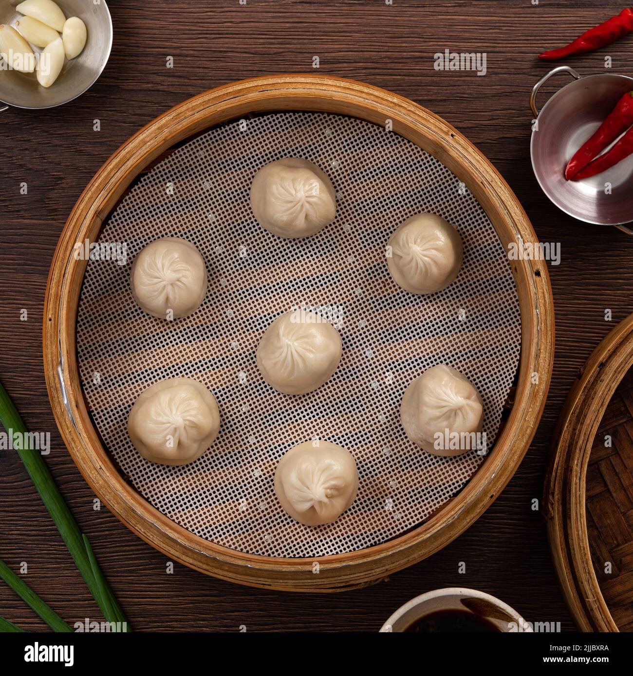 Eating steamed pork soup dumplings named Xiao long bao xiaolongbao in ...