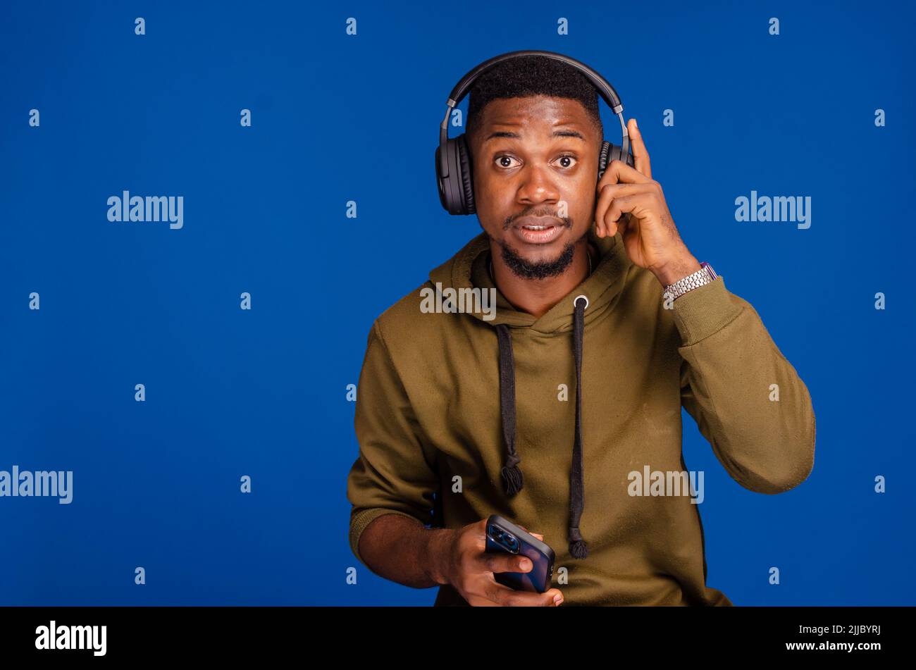 Cheerful African American man using mobile phone application Stock ...