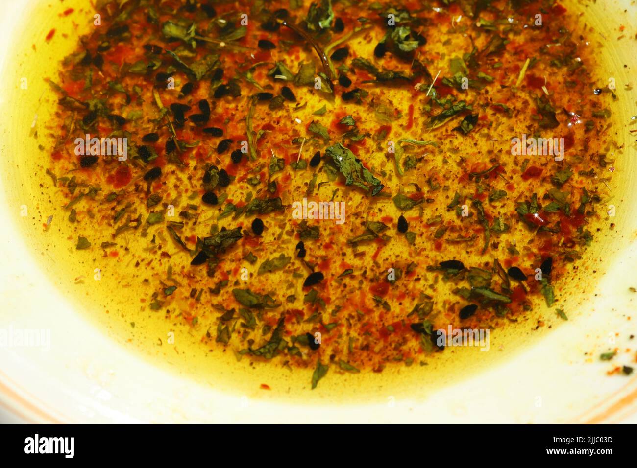 olive oil and various spices in the plate Stock Photo - Alamy