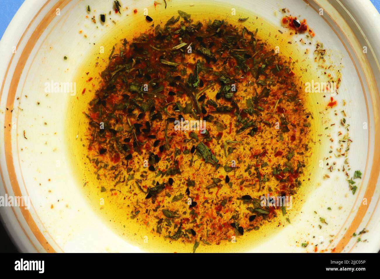 olive oil and various spices in the plate Stock Photo - Alamy