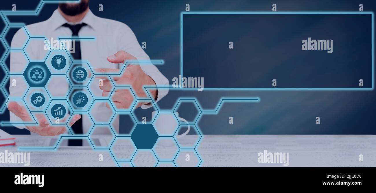 Businessman With A Touch Screen Displaying Digital Symbols In A Glowing ...