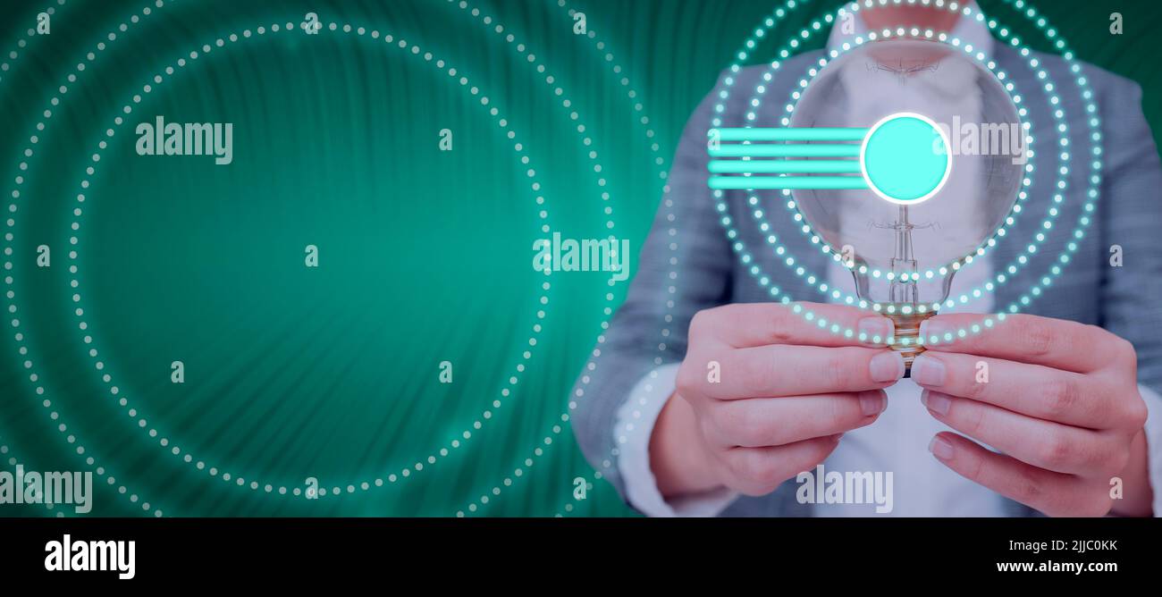 Businessman Holding Light Bulb And Showing Digitally Generated Graph ...