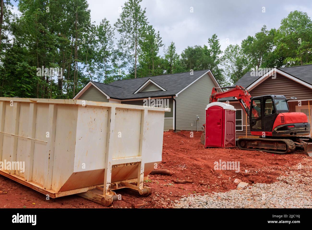 An industrial dumpster filled with rubbish removal containers on the ...