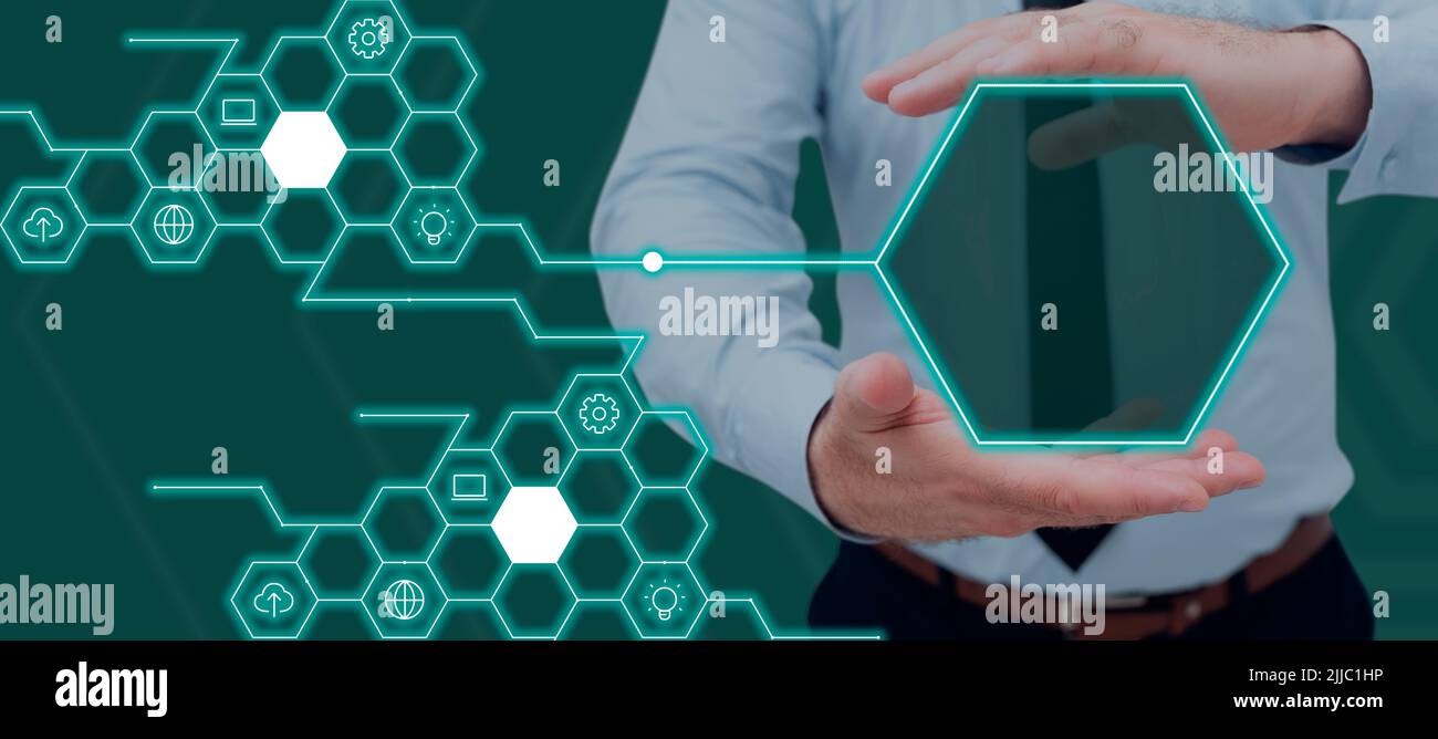 Businessman Holding Digitally Generated Hexagon In Hands Connected To ...