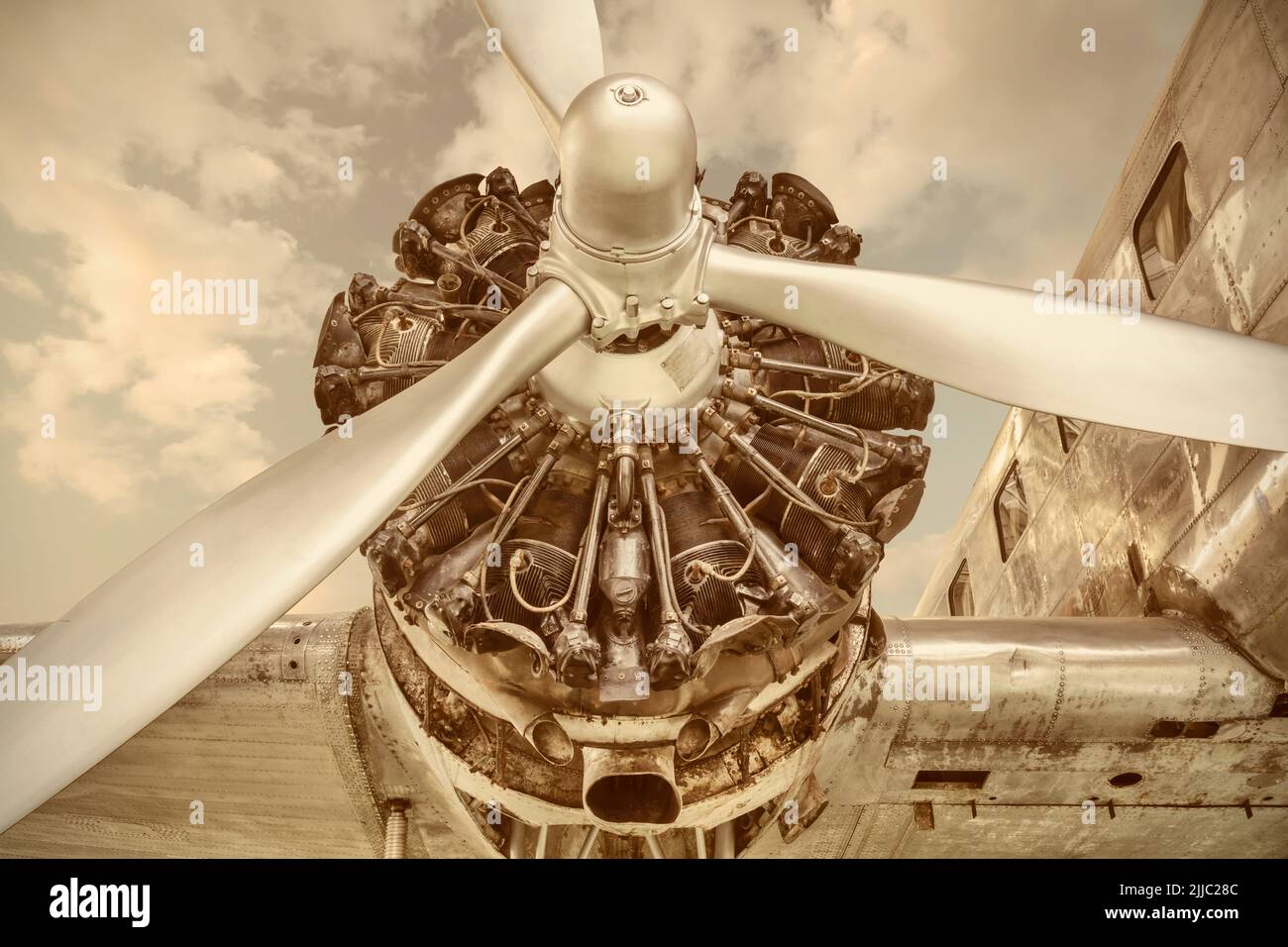 Retro styled image of a 1934 ancient passenger airplane engine with ...