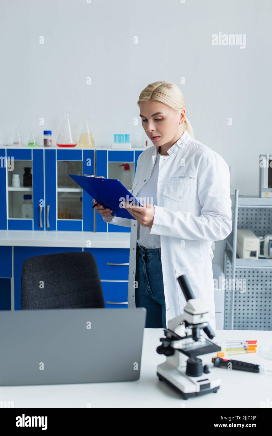Laptop woman laboratory microscope hi-res stock photography and images ...