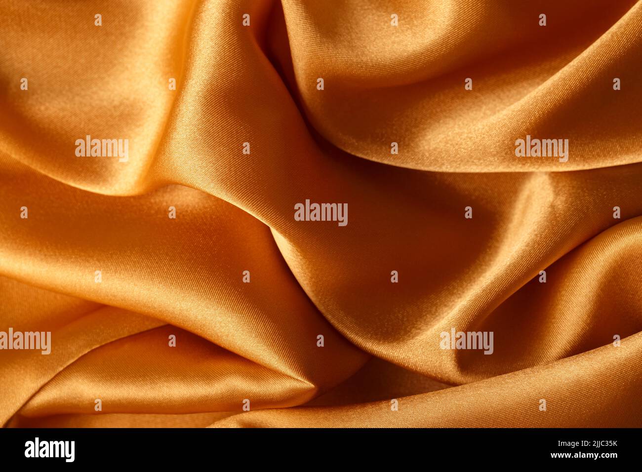 Texture of orange silk fabric, close up Stock Photo - Alamy