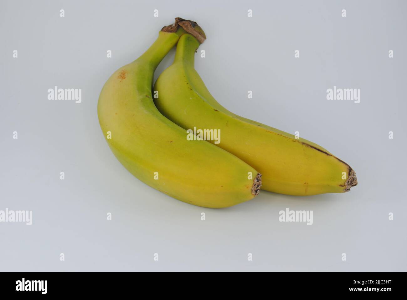 Two bananas in white back Stock Photo - Alamy