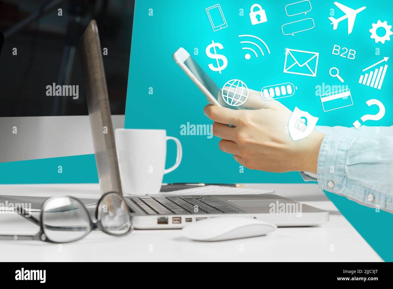 Young woman sitting at the table with open netbook computer. Female ...