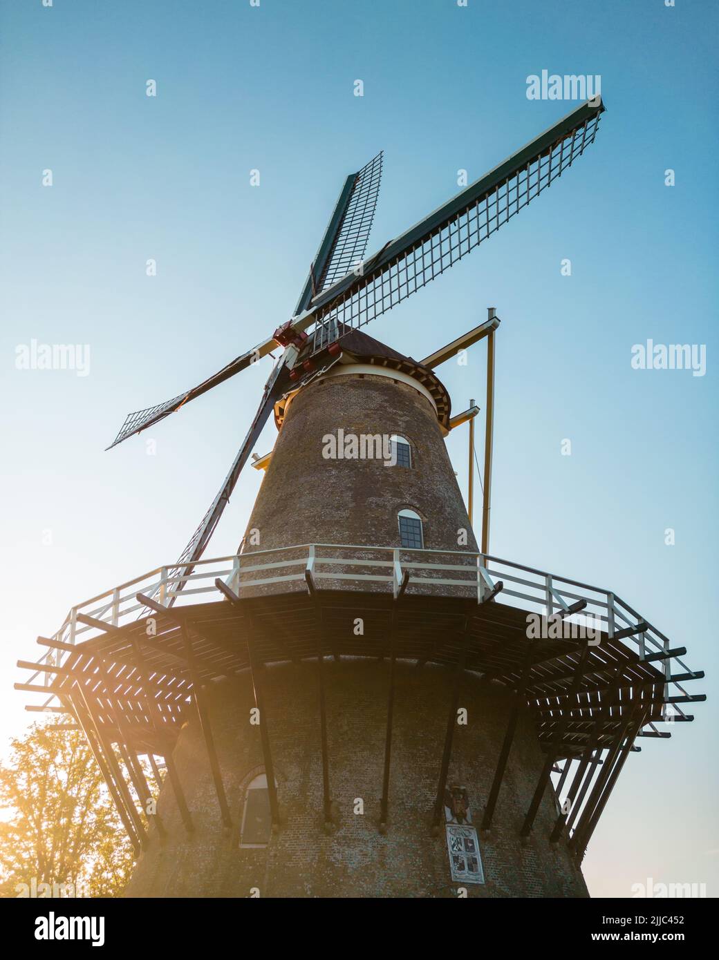 A vertical low angle shot of Molen De Valk tower mill and museum in ...