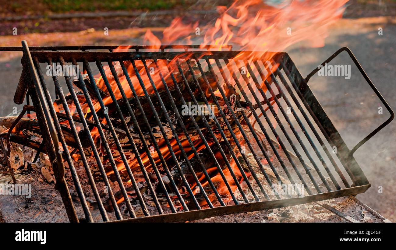 Detail of grill grid on fire. Fireball igniting on grill Stock Photo ...