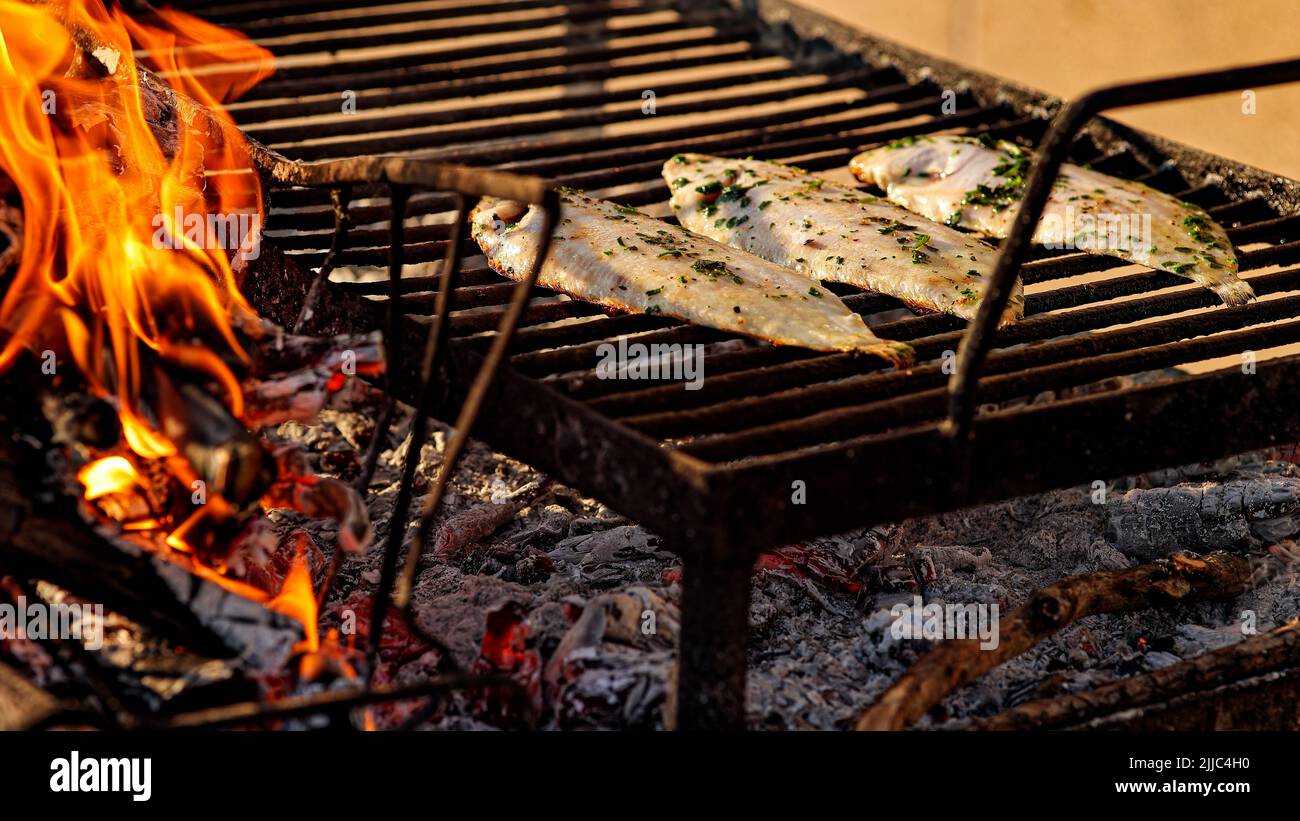 Tasty Grilled sole food detail with smoke Stock Photo - Alamy