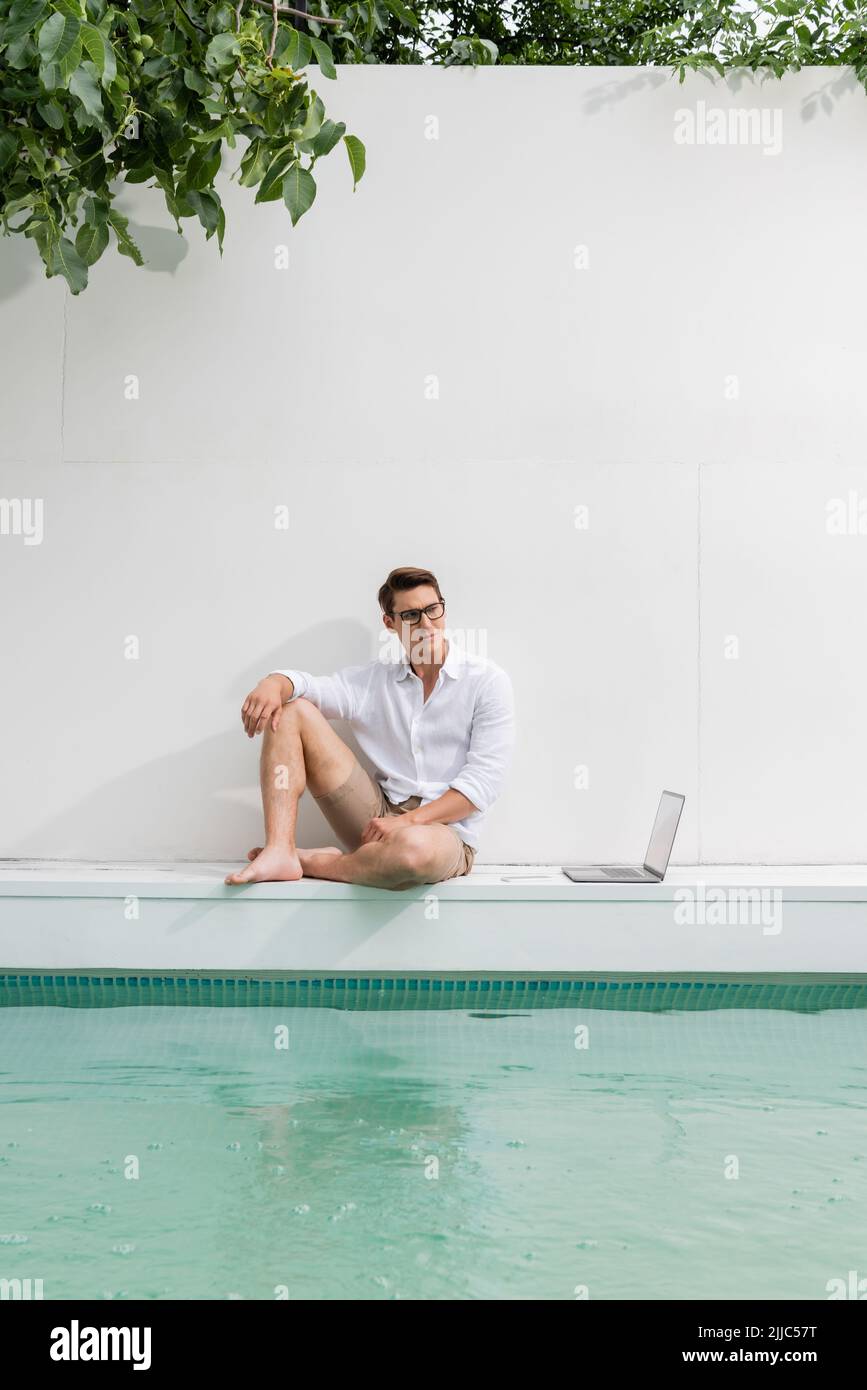 Barefoot laptop man hi-res stock photography and images - Alamy