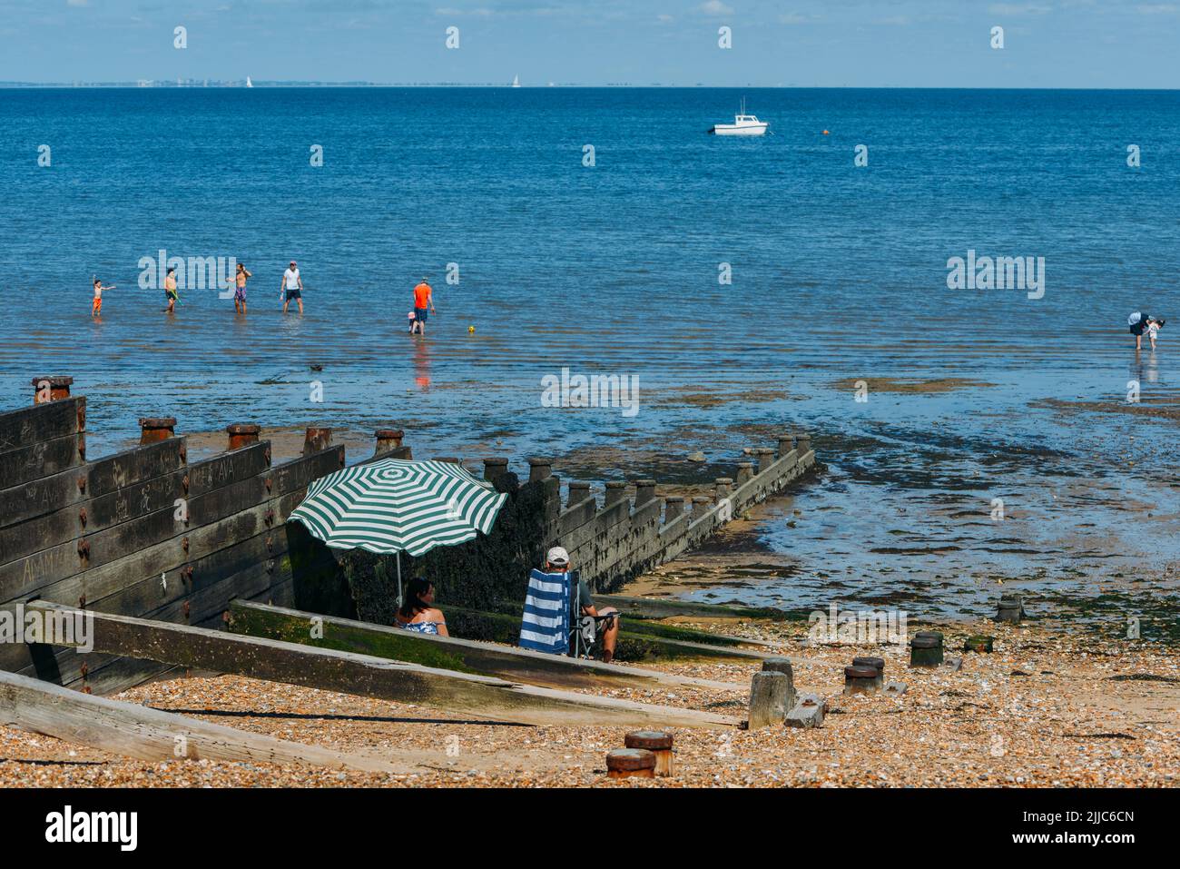 Whitstable, UK - July 16, 2022: People relax on the beach in Whitstable ...
