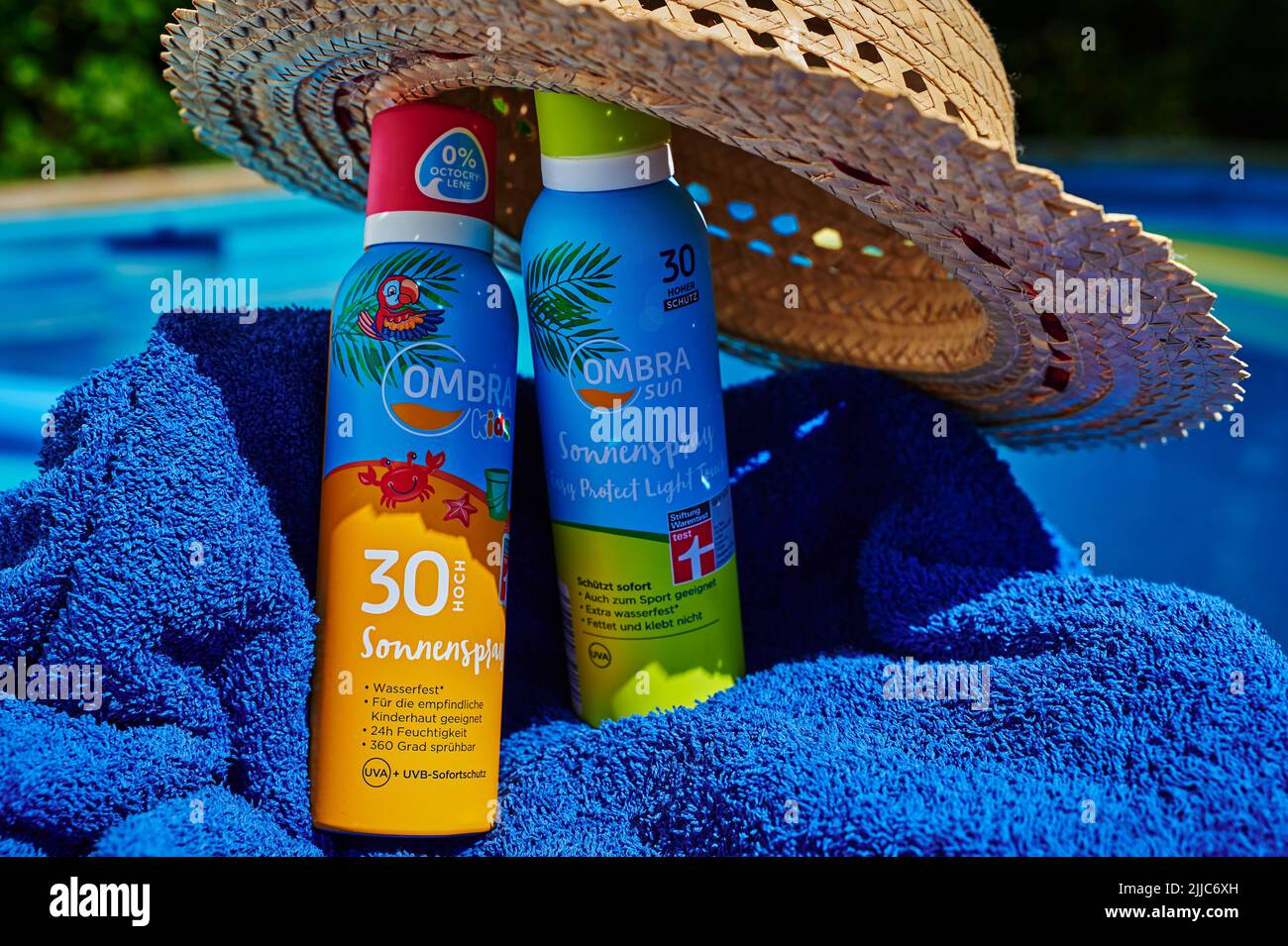 Berlin, Germany - July 24, 2022: Anti-sunburn spray on a blue towel by ...