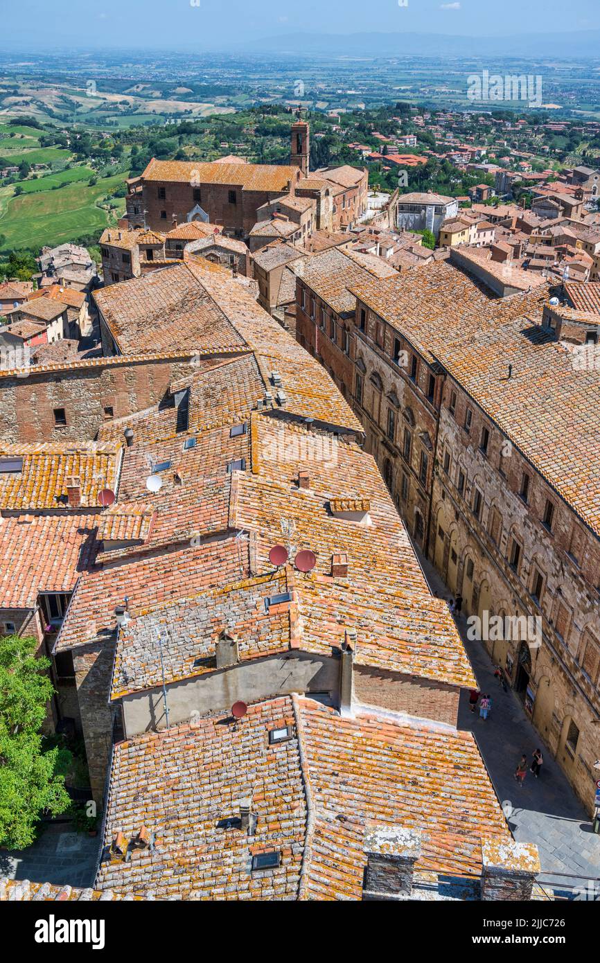 View across rooftops looking down Via Ricci to the lower town in the ...