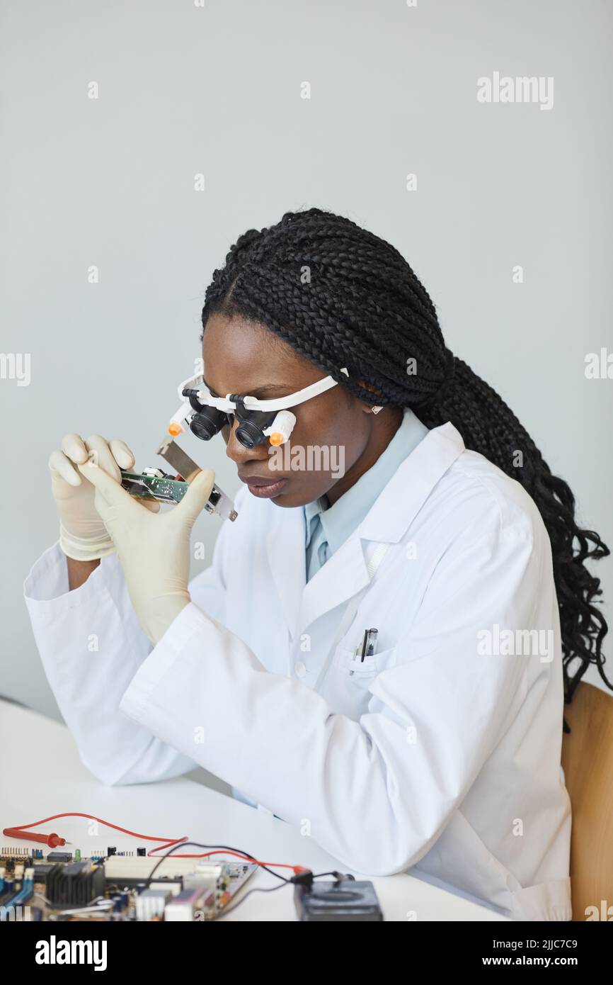 Inspecting parts hi-res stock photography and images - Alamy