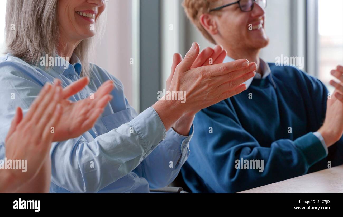Business audience people group smiling applauding sitting at conference ... Business audience people group smiling applauding sitting at conference ...