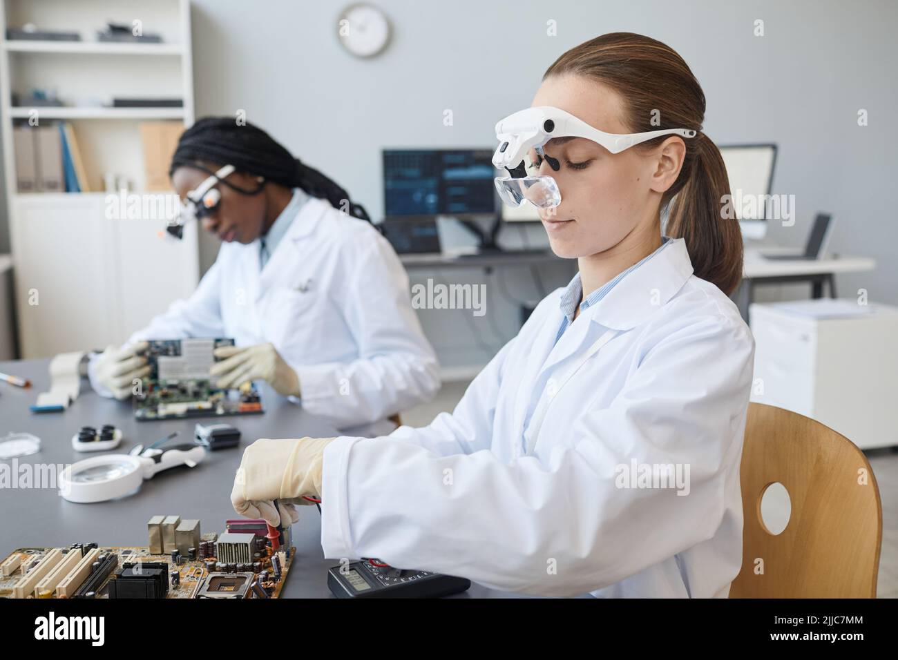 Two engineers looking at computer hi-res stock photography and images ...