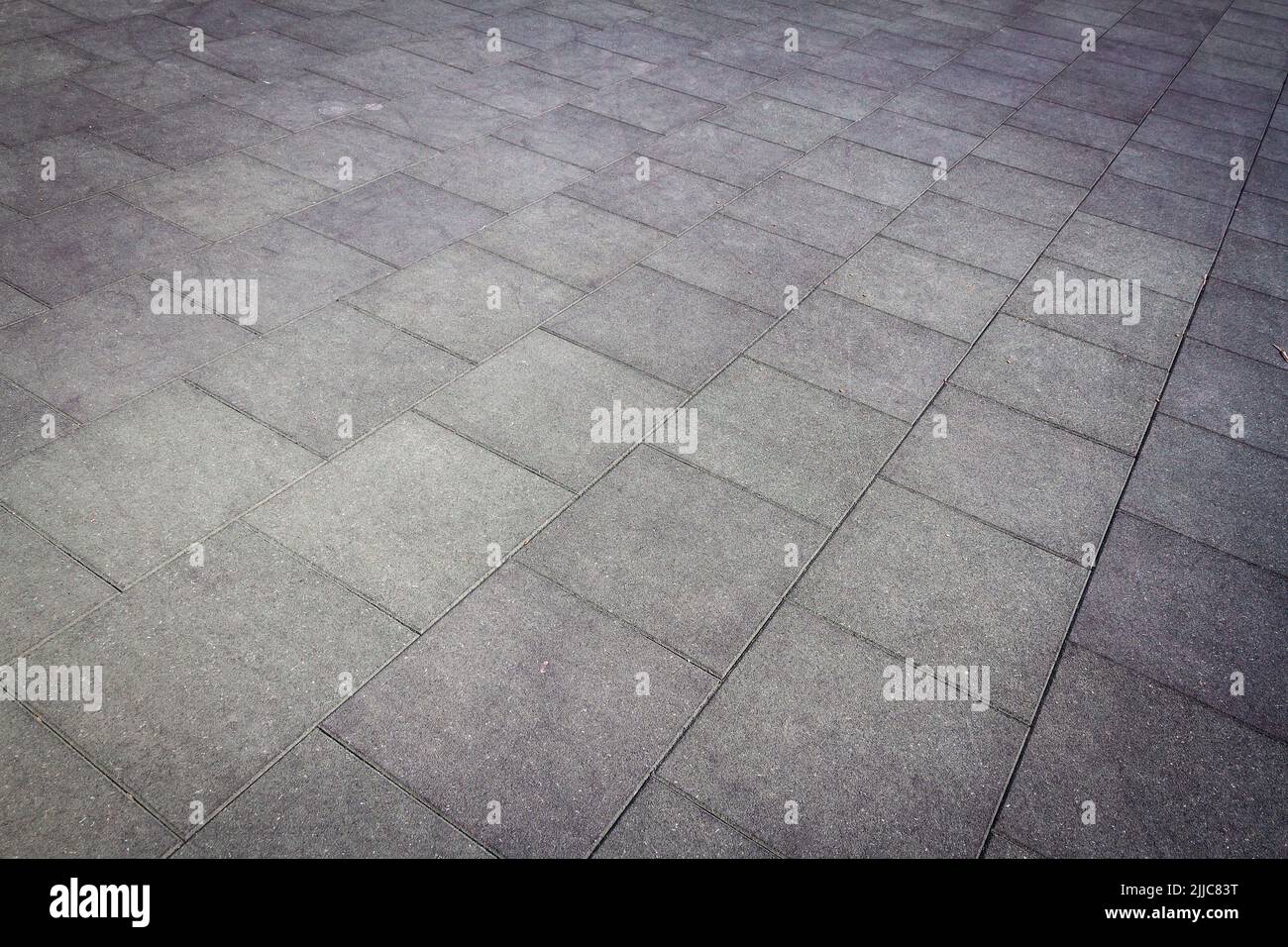 Old concrete tiles in the walkway. Abstract architecture background ...
