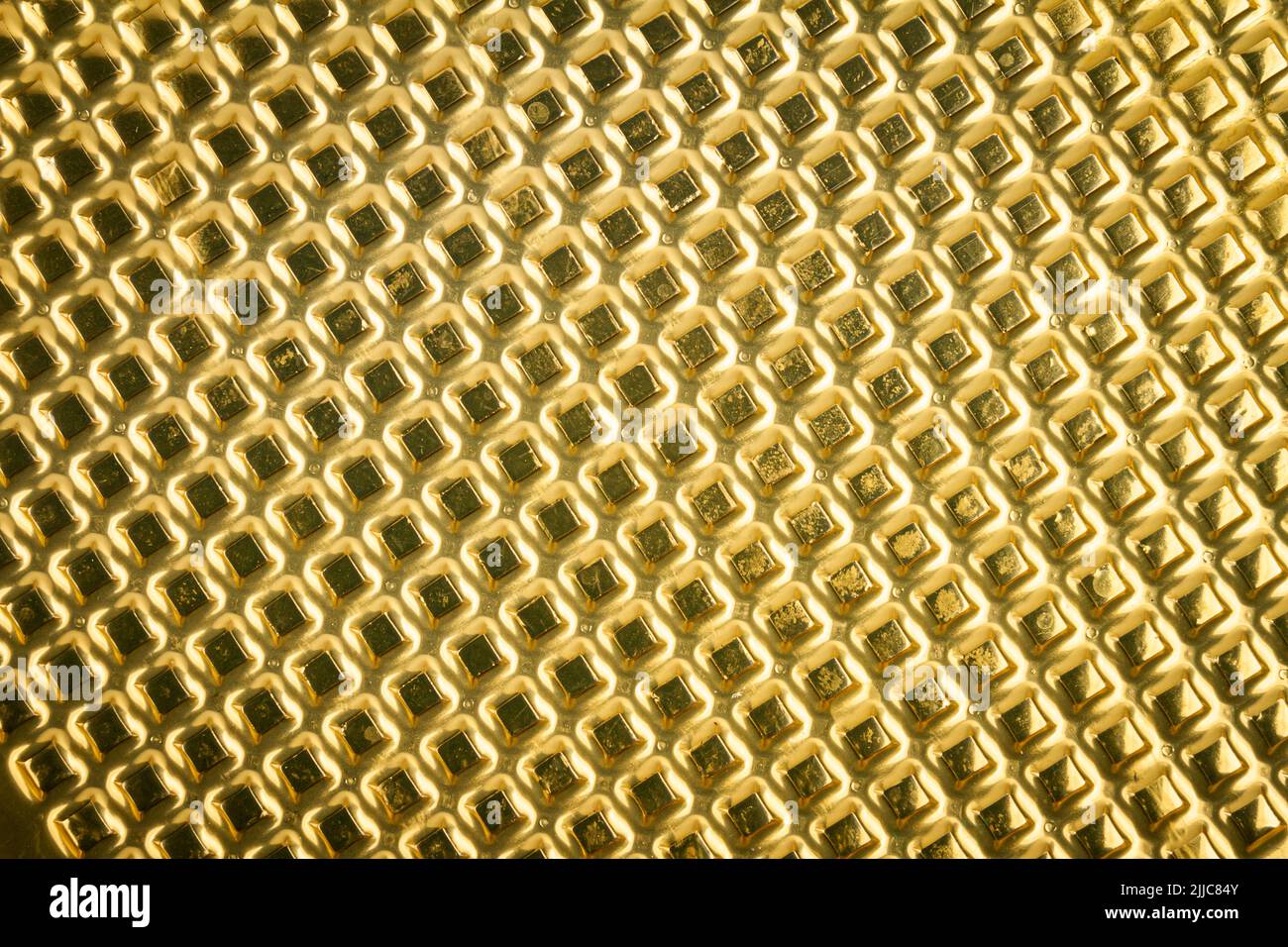 Golden plastic packaging food tray texture background Stock Photo - Alamy