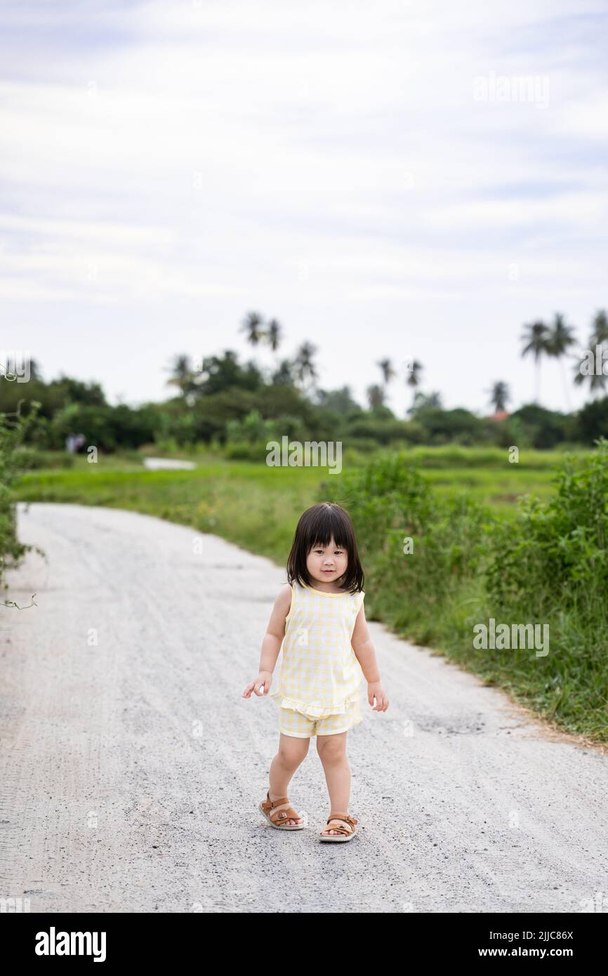 Cute little girl exploring the nature of paddy field. Excited for the ...