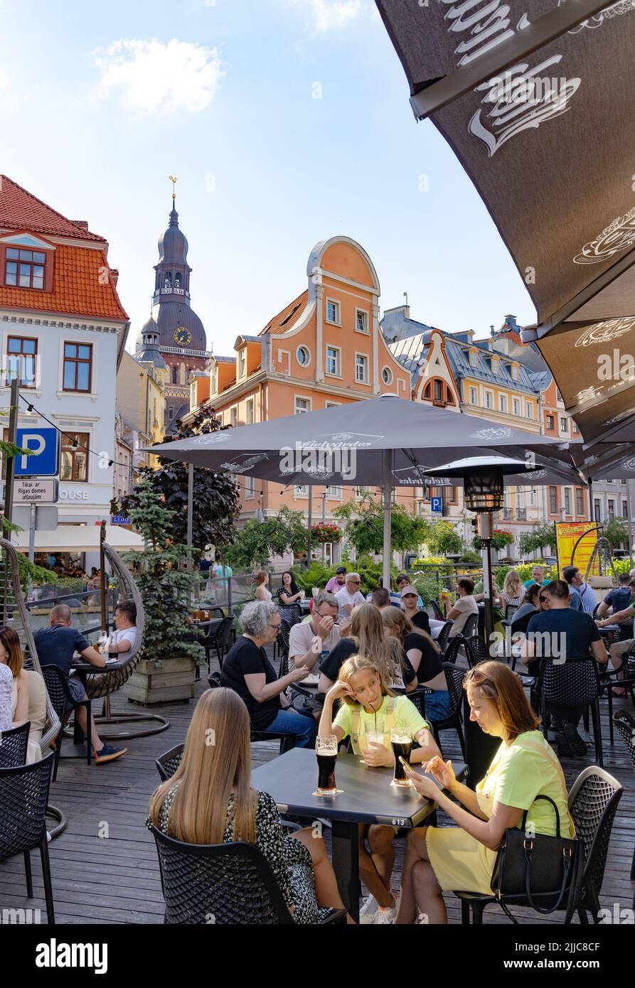 Riga cafe; people drinking at a cafe in Riga Old town in summer ...