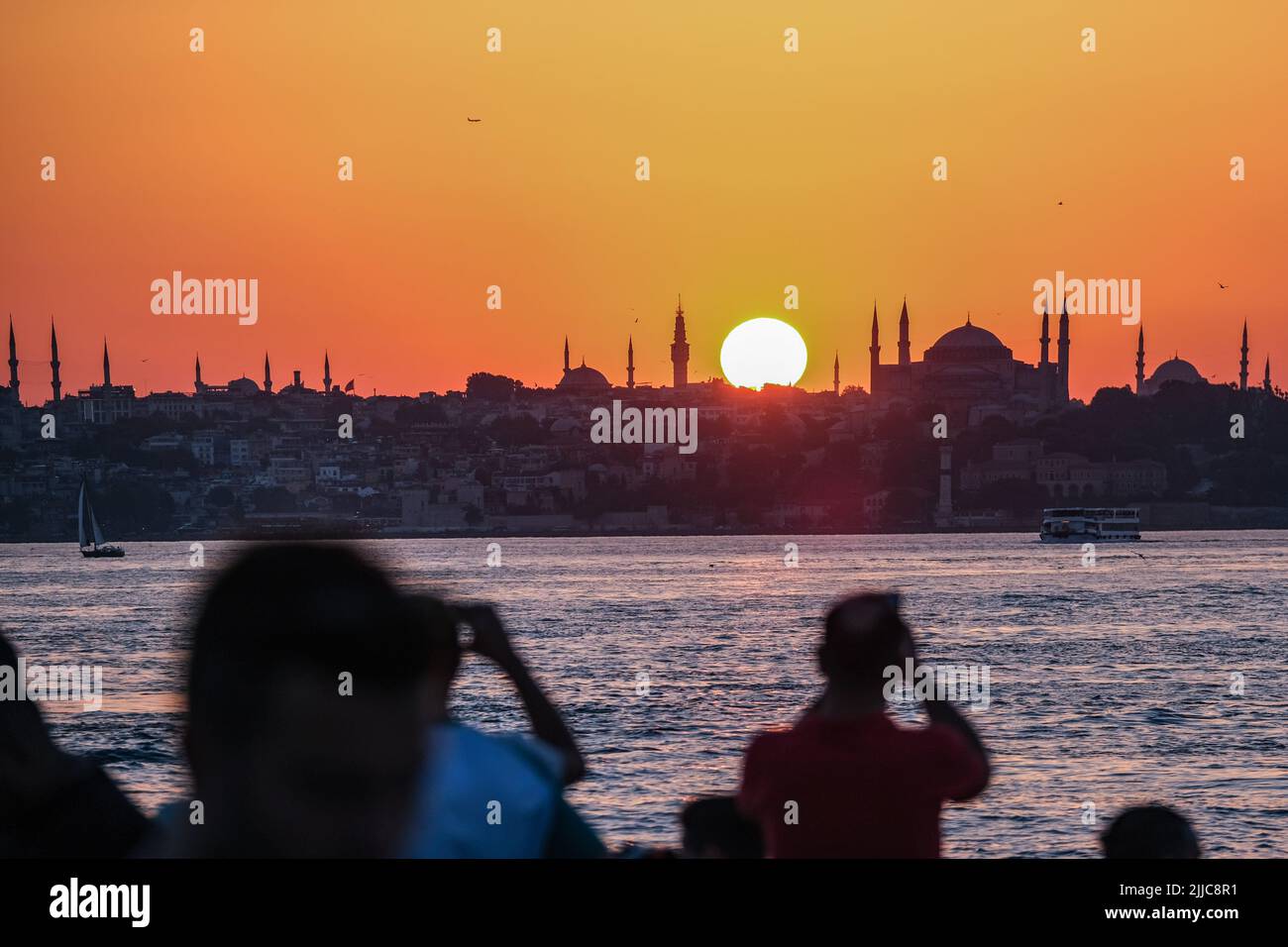 Silhouettes of people taking photos of the Hagia Sophia skyline during ...