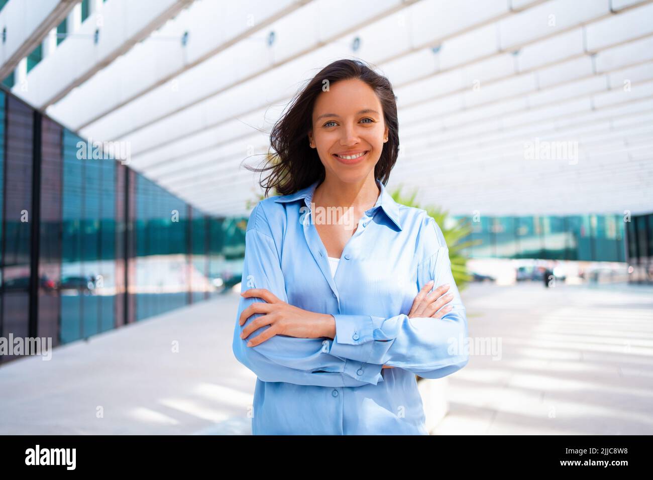 Confidence Businesswoman portrait with crossed hands. Pretty business ...