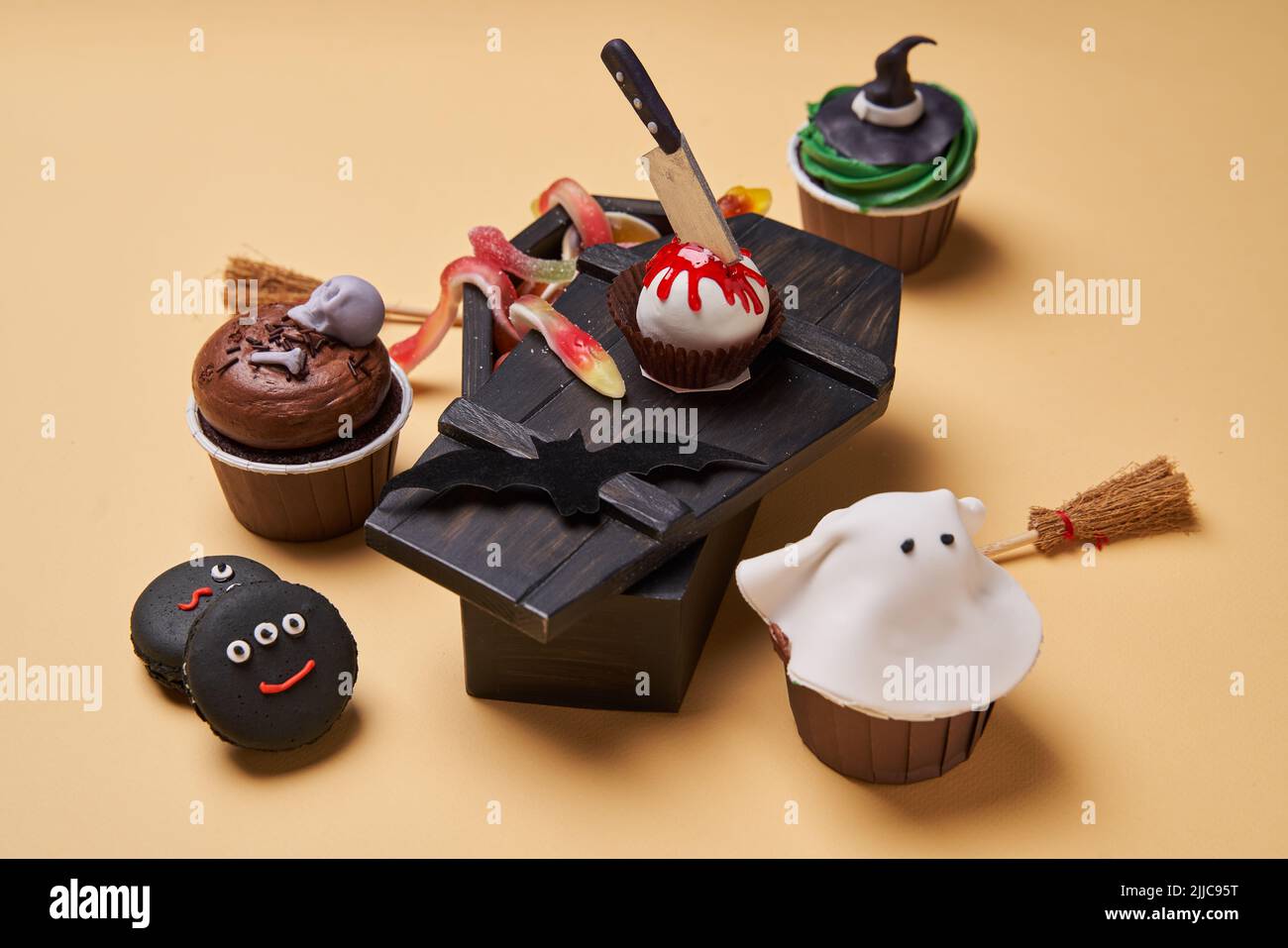 Macarons and muffins decorated for monsters, skeleton, ghost and witch ...