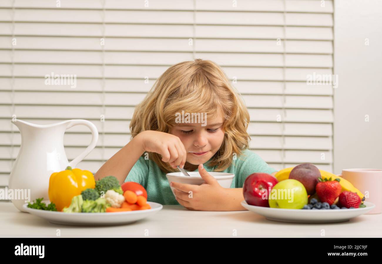 Little child boy having healthy breakfast. Kids nutrition and ...