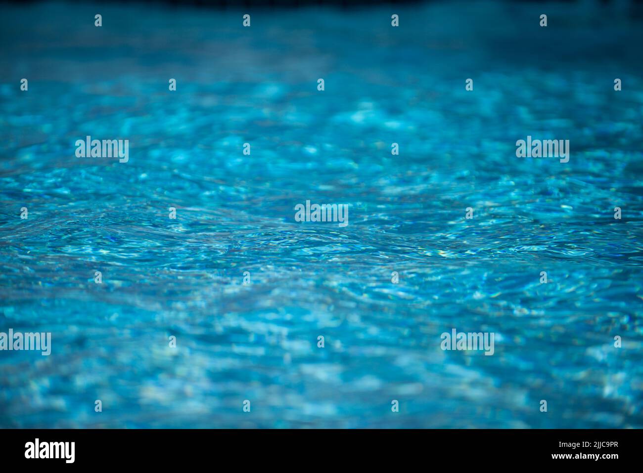 Abstract ripple wave and clear turquoise water surface in swimming pool ...