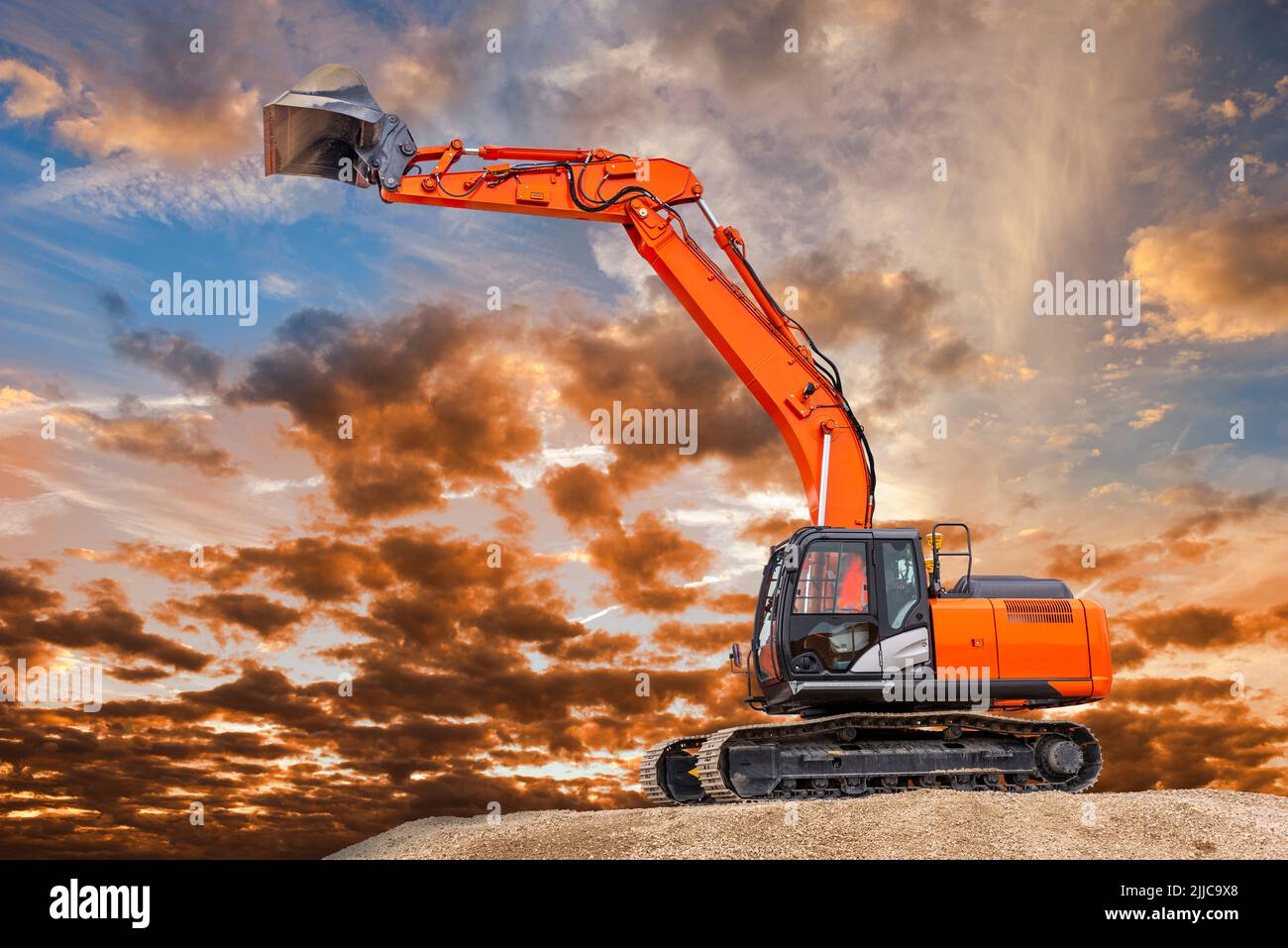 excavator is digging at construction site Stock Photo - Alamy