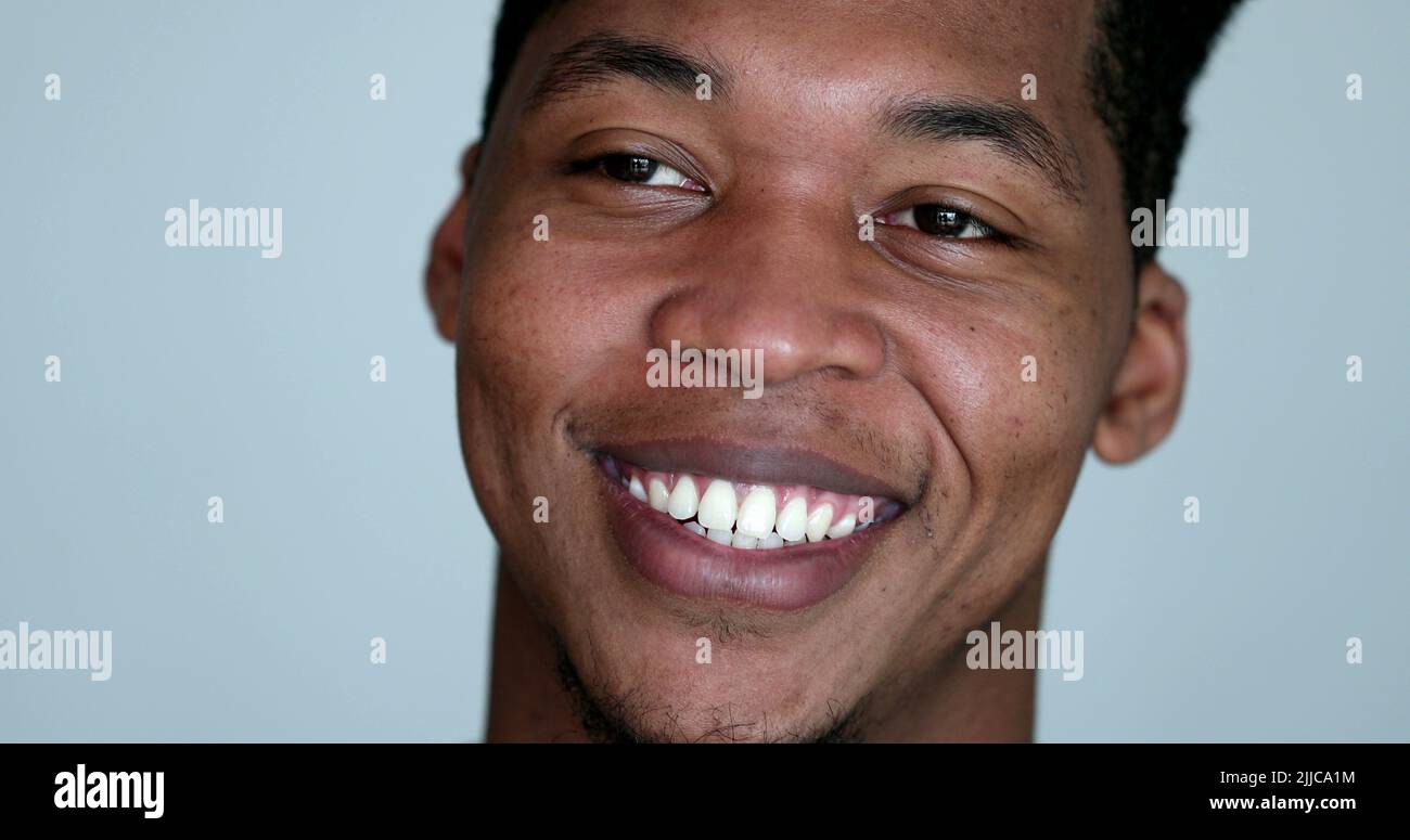 Handsome young black African person smiling portrait Stock Photo - Alamy