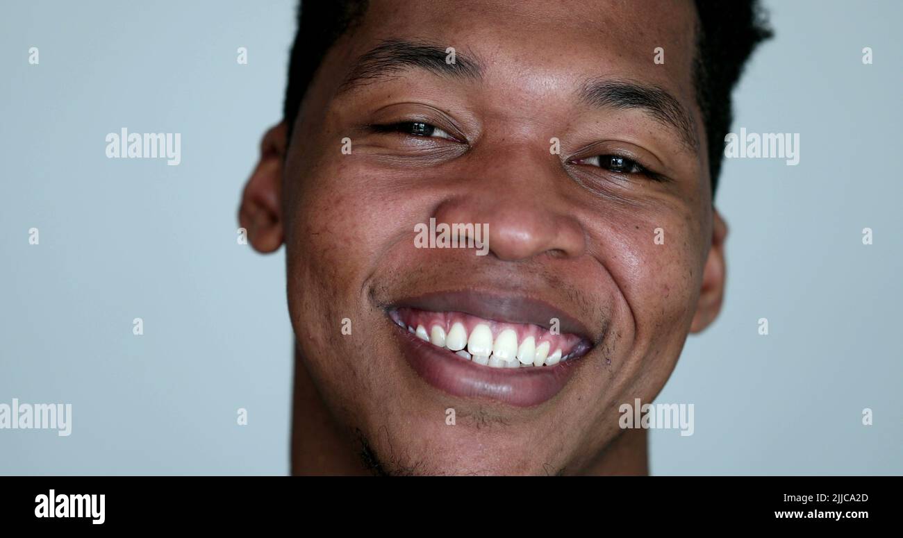 Handsome young black African person smiling portrait Stock Photo - Alamy