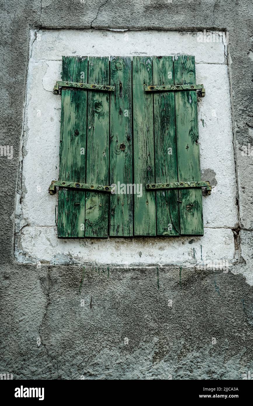 Old green window shutters in Radunica, a historic downtown ...