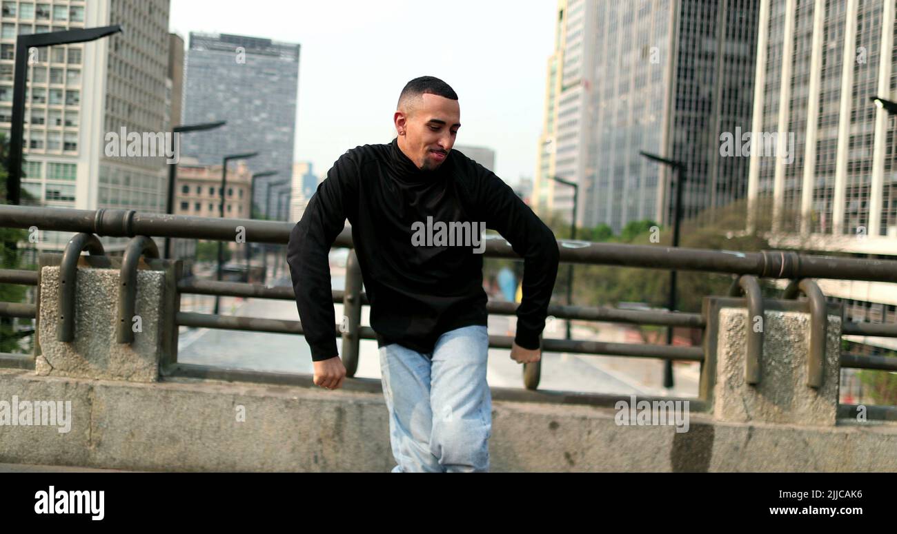 Happy hispanic man dancing celebrating Stock Photo - Alamy