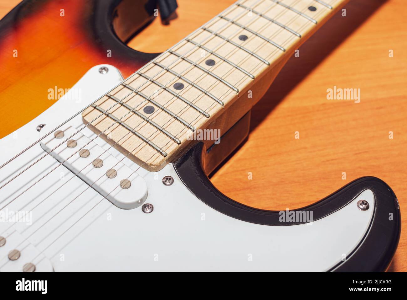 Electric guitar close-up, string body and fretboard Stock Photo - Alamy