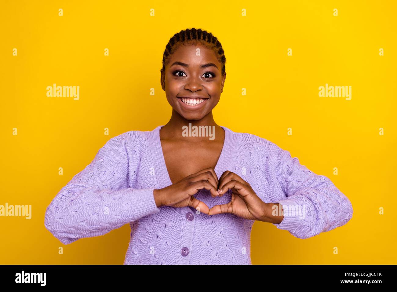 Photo of adorable cheerful girl arms fingers show heart gesture toothy ...