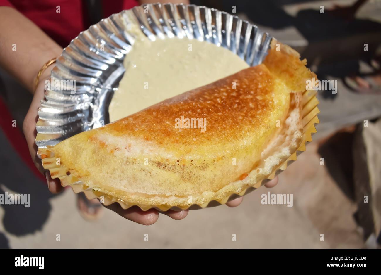 A Selective focus Picture of Women Holding a Freshly made Ghee Roosted ...
