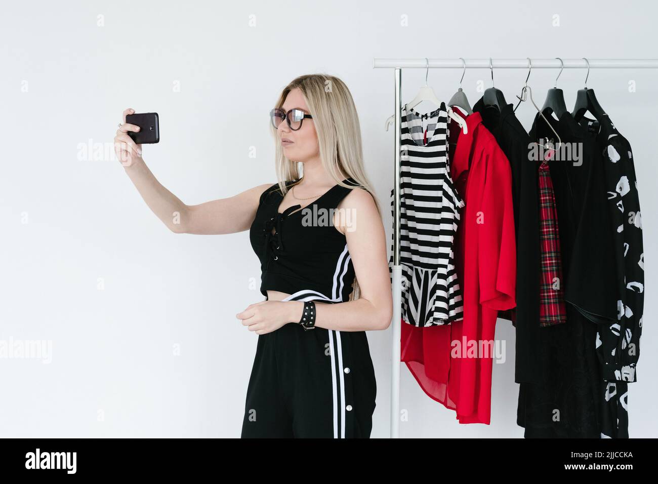 fashion designer mobile selfie apparel collection Stock Photo - Alamy