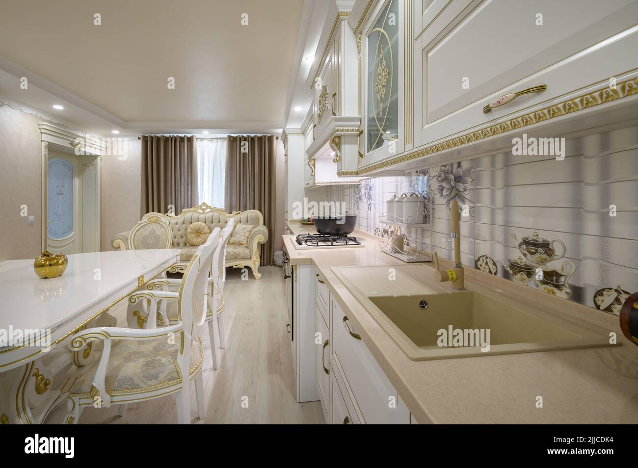 Renovated Interior of rich classic white kitchen Stock Photo - Alamy