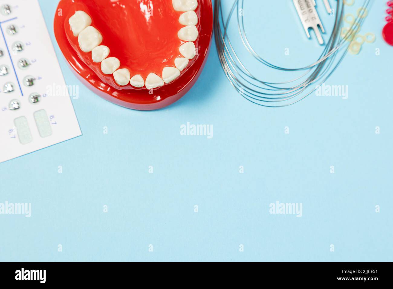 a set of special tools for an orthodontist to install braces for a ...