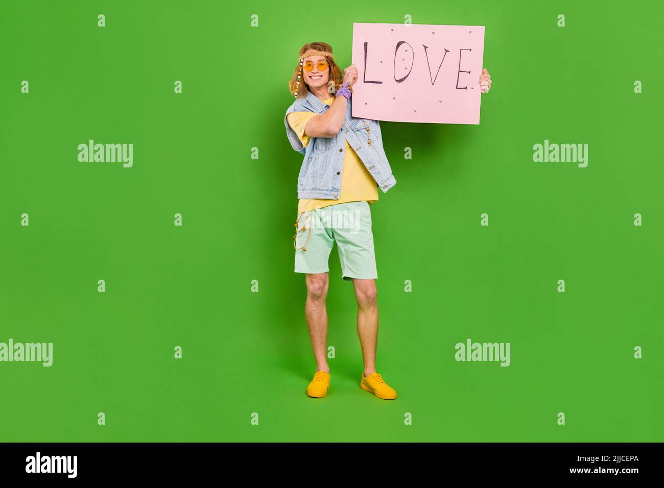 Full body photo of positive cheerful person hold paper love card ...