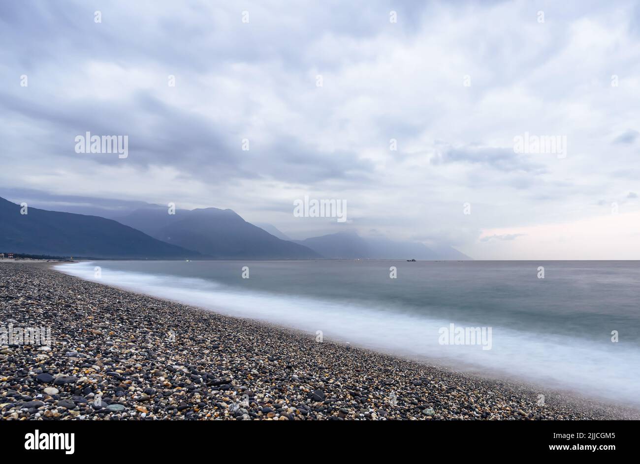 Beautiful scenic of ocean with sprawling stone covered beach ...