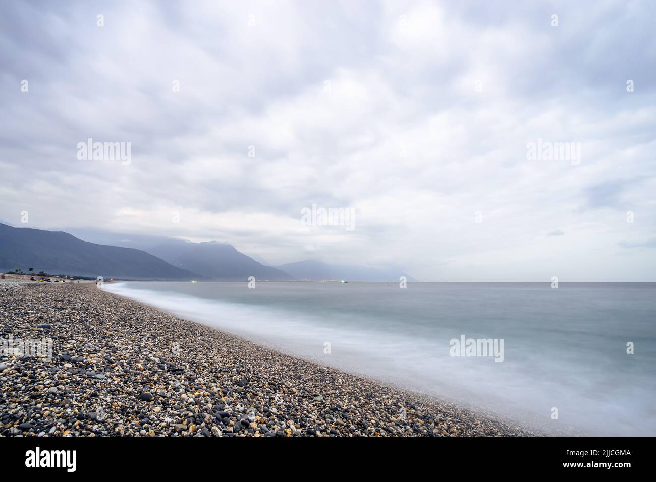 Beautiful scenic of ocean with sprawling stone covered beach ...