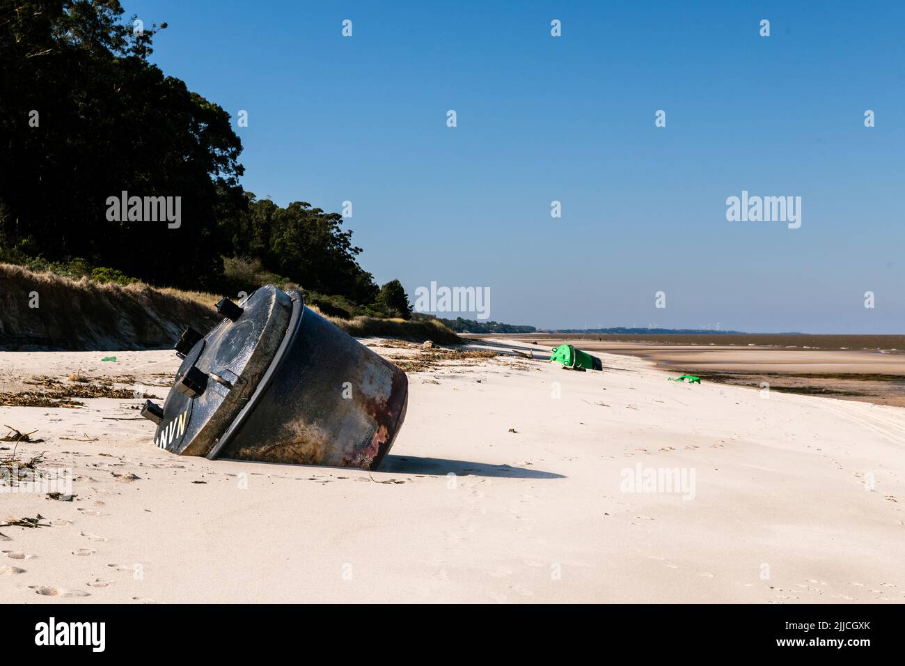 Black signaling beacon aground on the beach, Kiyu, San José, Uruguay ...