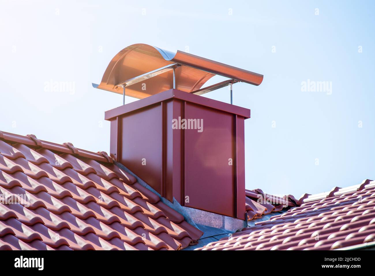 Chimney with standing seam cladding and aluminium sheet on a newly ...