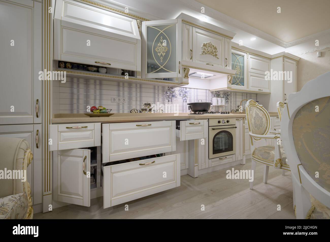 Renovated Interior of rich classic white kitchen Stock Photo - Alamy