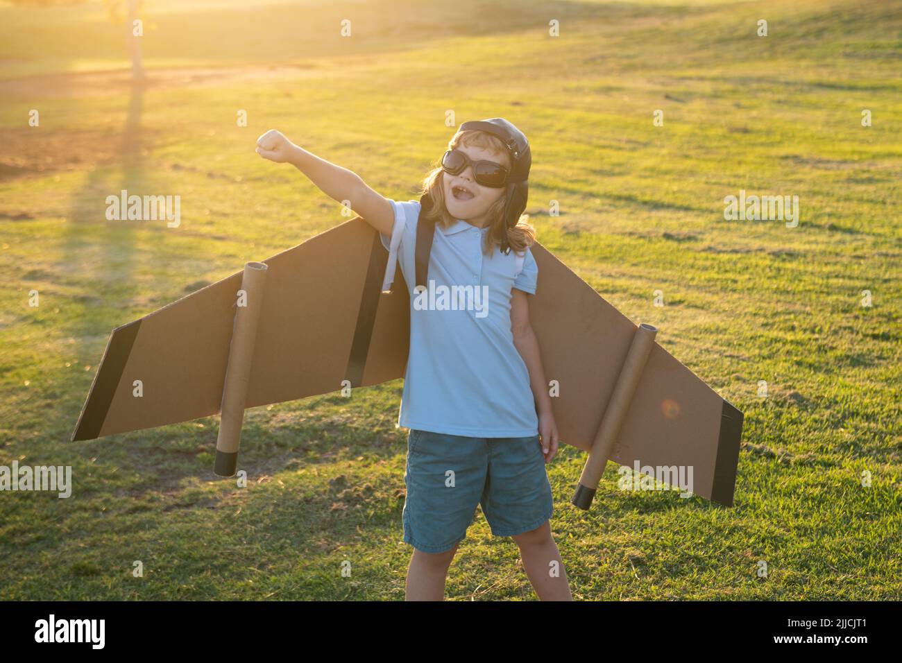 Kid superhero with jetpack. Child pilot play on summer day. Success ...